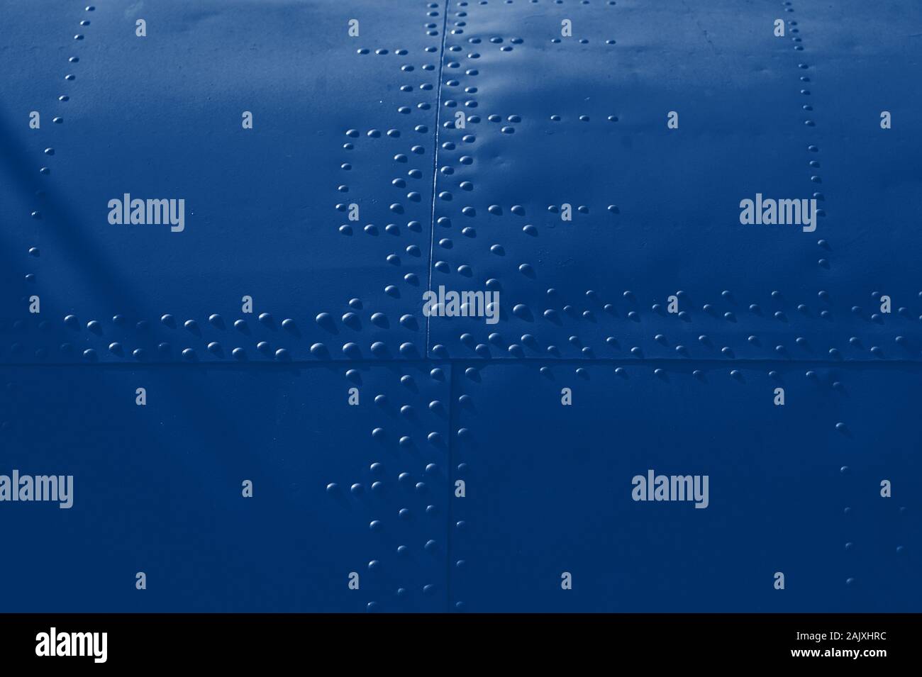 texture covering aircraft rivets for background. Classic blue toning ...