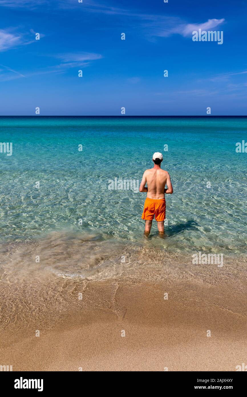Man in the water at the sea concept of a happy holiday and freedom ...