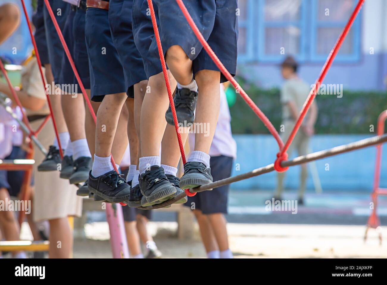Children walk to school on rope hi-res stock photography and images - Alamy