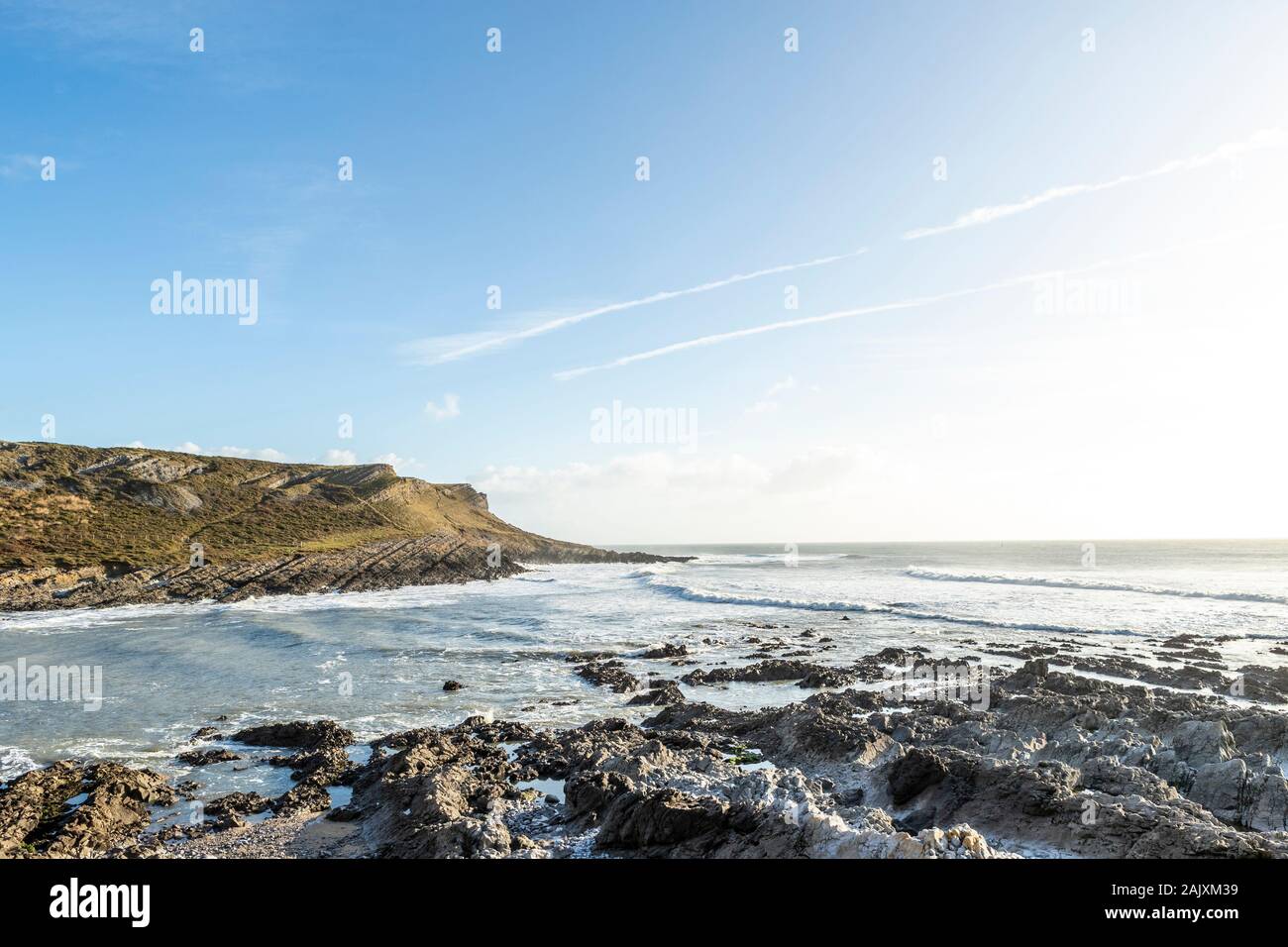 Waves roll in. Port Eynon Point from Overton Cliff, Gower Peninsula ...