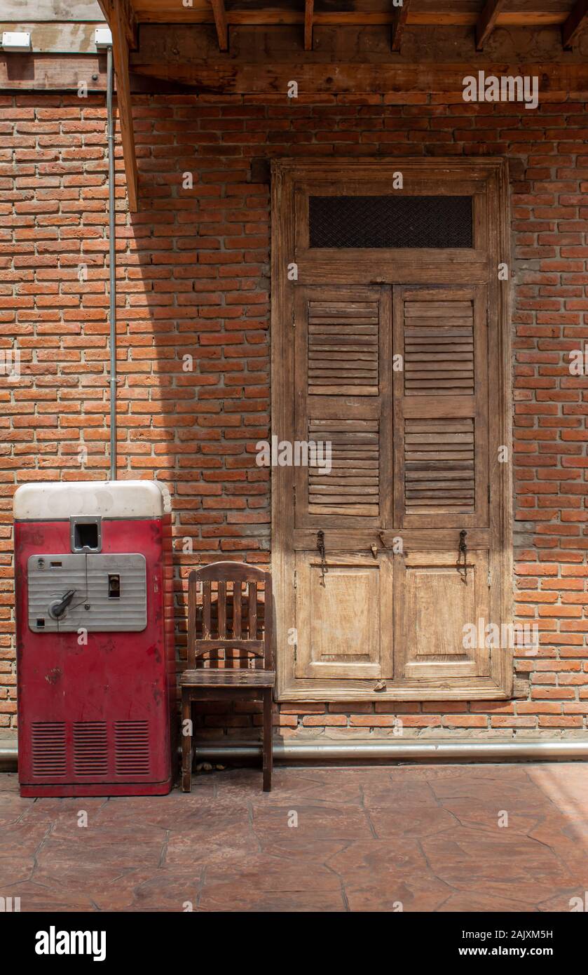 Striped brick walls and wooden door is used as the background Stock ...