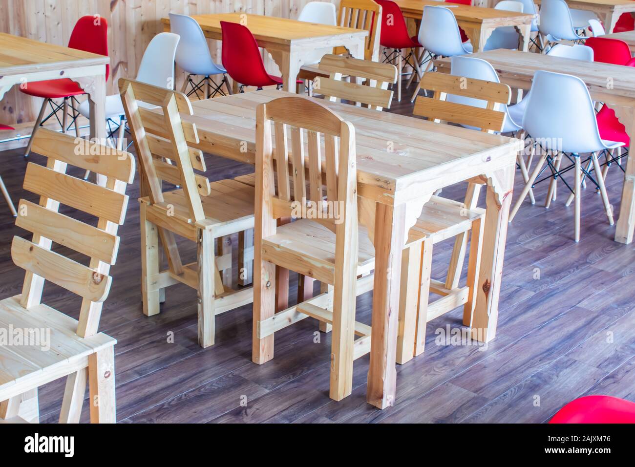 Wooden tables and chairs Stock Photo - Alamy