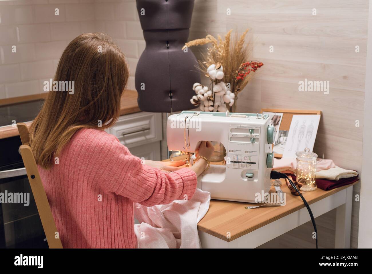 Girl works sewing machine hi-res stock photography and images - Alamy