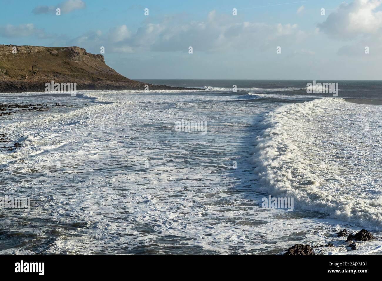 Waves roll in. Port Eynon Point from Overton Cliff, Gower Peninsula ...