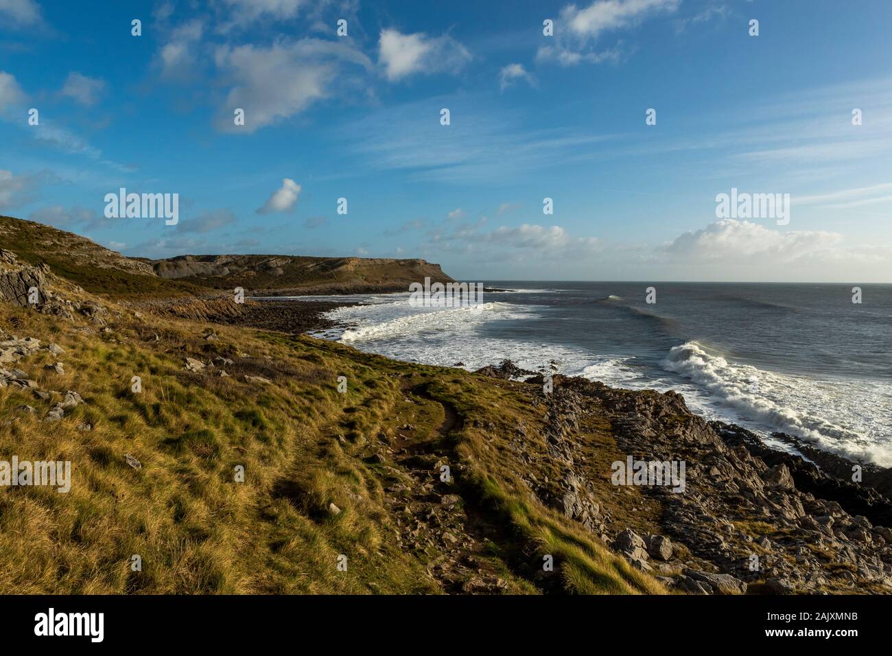 Waves roll in. Port Eynon Point from Overton Cliff, Gower Peninsula ...