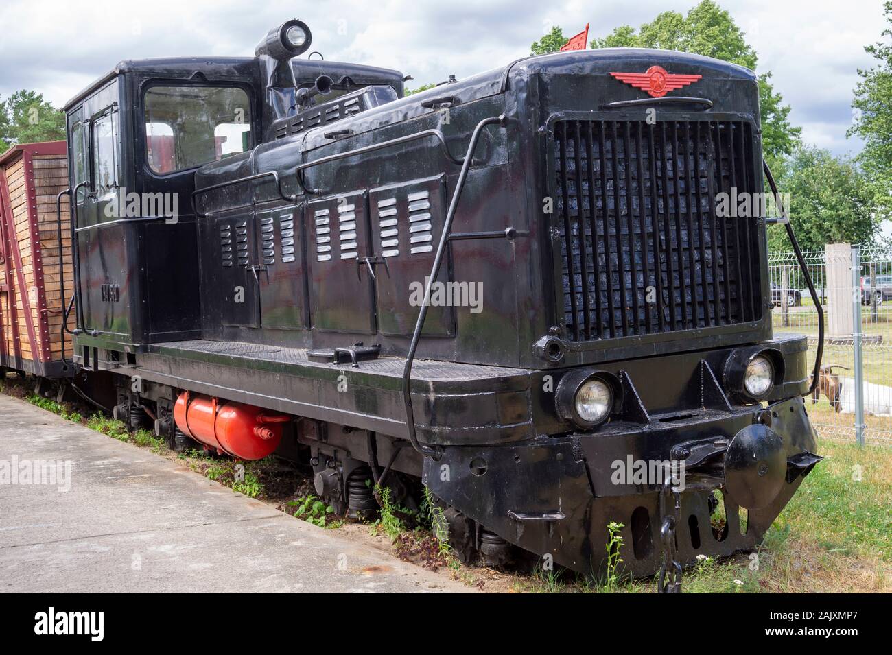 Old vintage locomotive train painted black with red elements, parked in ...