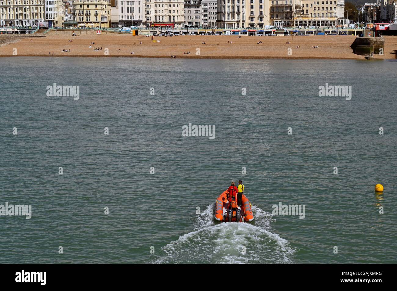 Small lifeboat craft patrolling the coast of Brighton England Stock ...