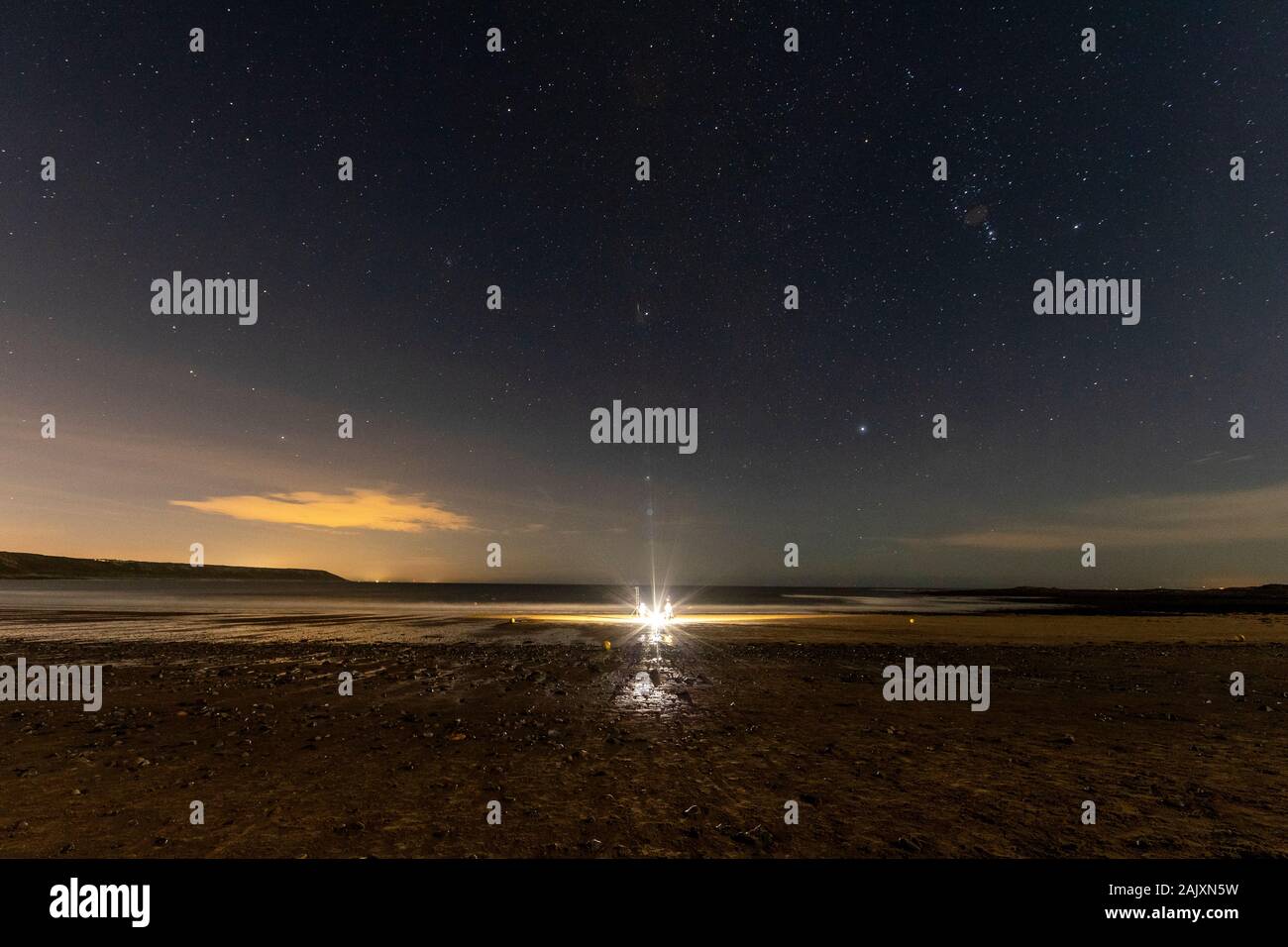 Night time sea fishing beachcasters. Port Eynon, Gower Peninsula, Wales ...