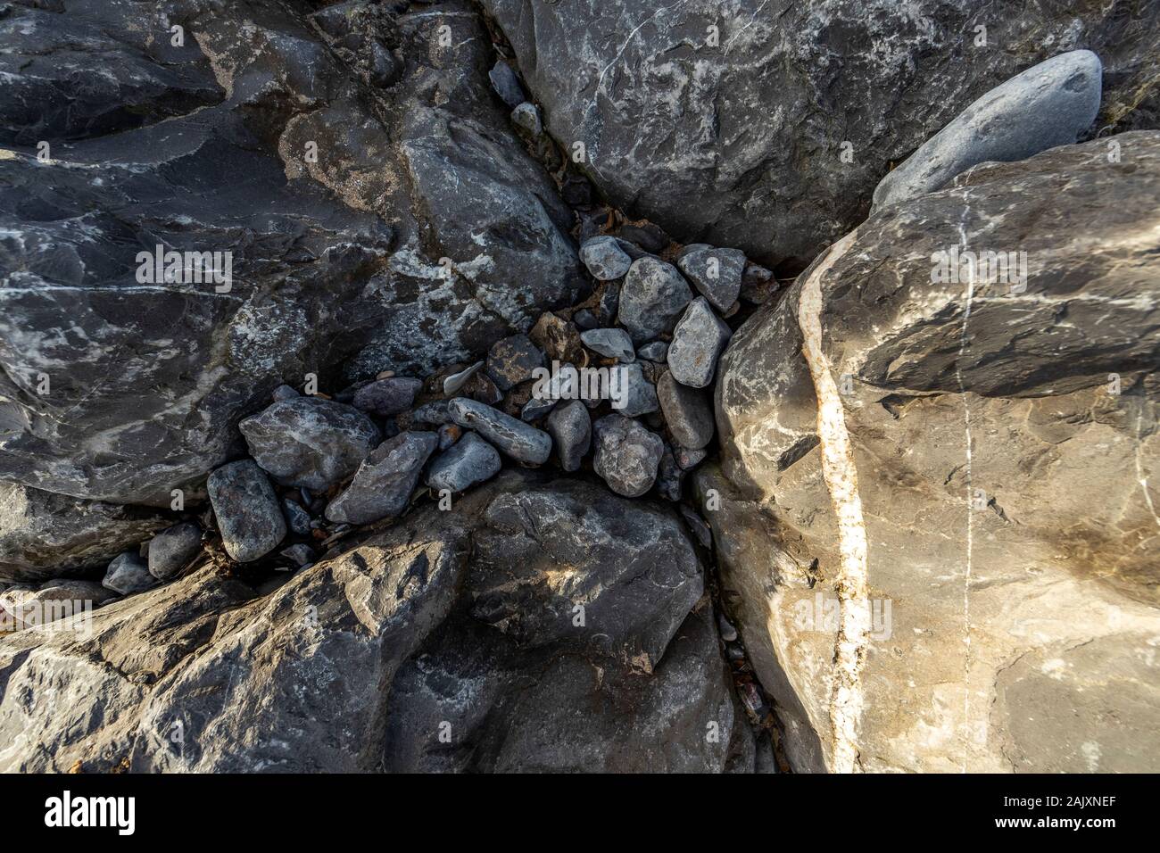 Interesting rock formations at Port Eynon, Gower Peninsula, Wales Stock ...