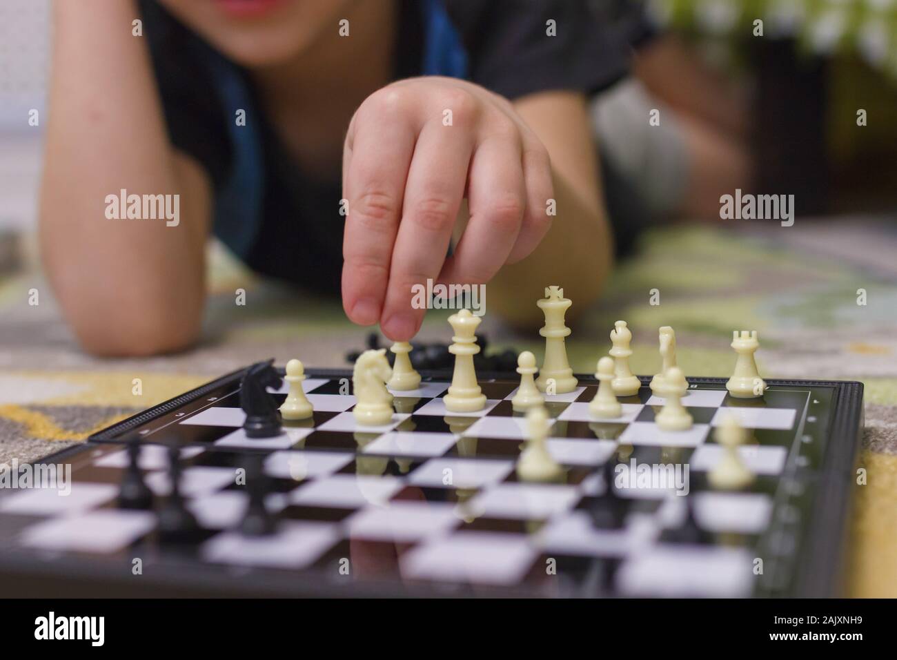 Boy play in the chess. without face Stock Photo - Alamy