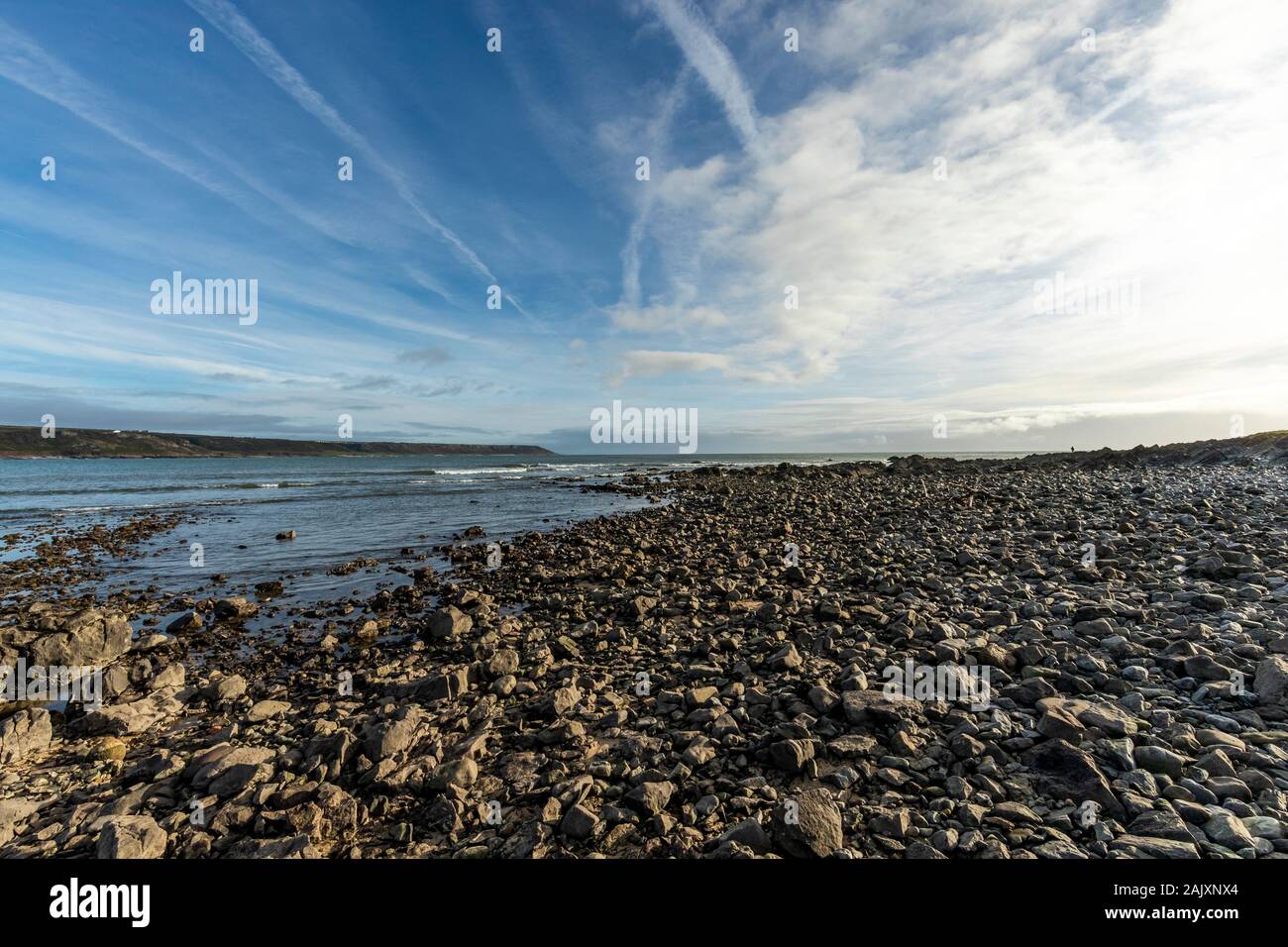 Rocky shoreline at the salthouse spit. Port Eynon, Gower Peninsula ...