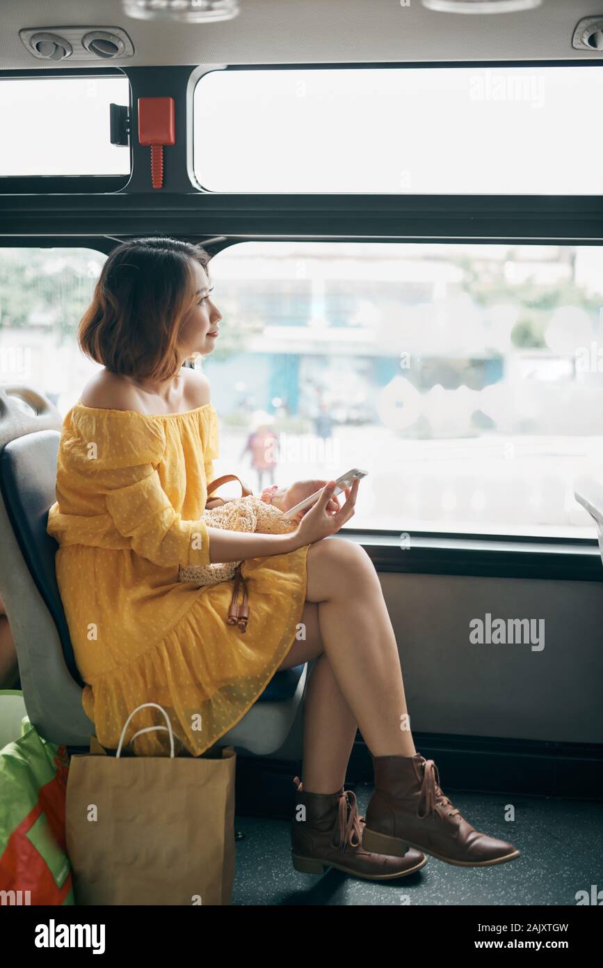 Women looking outside bus hi-res stock photography and images - Alamy