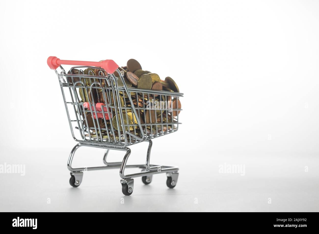 Thrree-Quarter Back View of Tiny Shopping Trolley Full of Euro Coins on ...