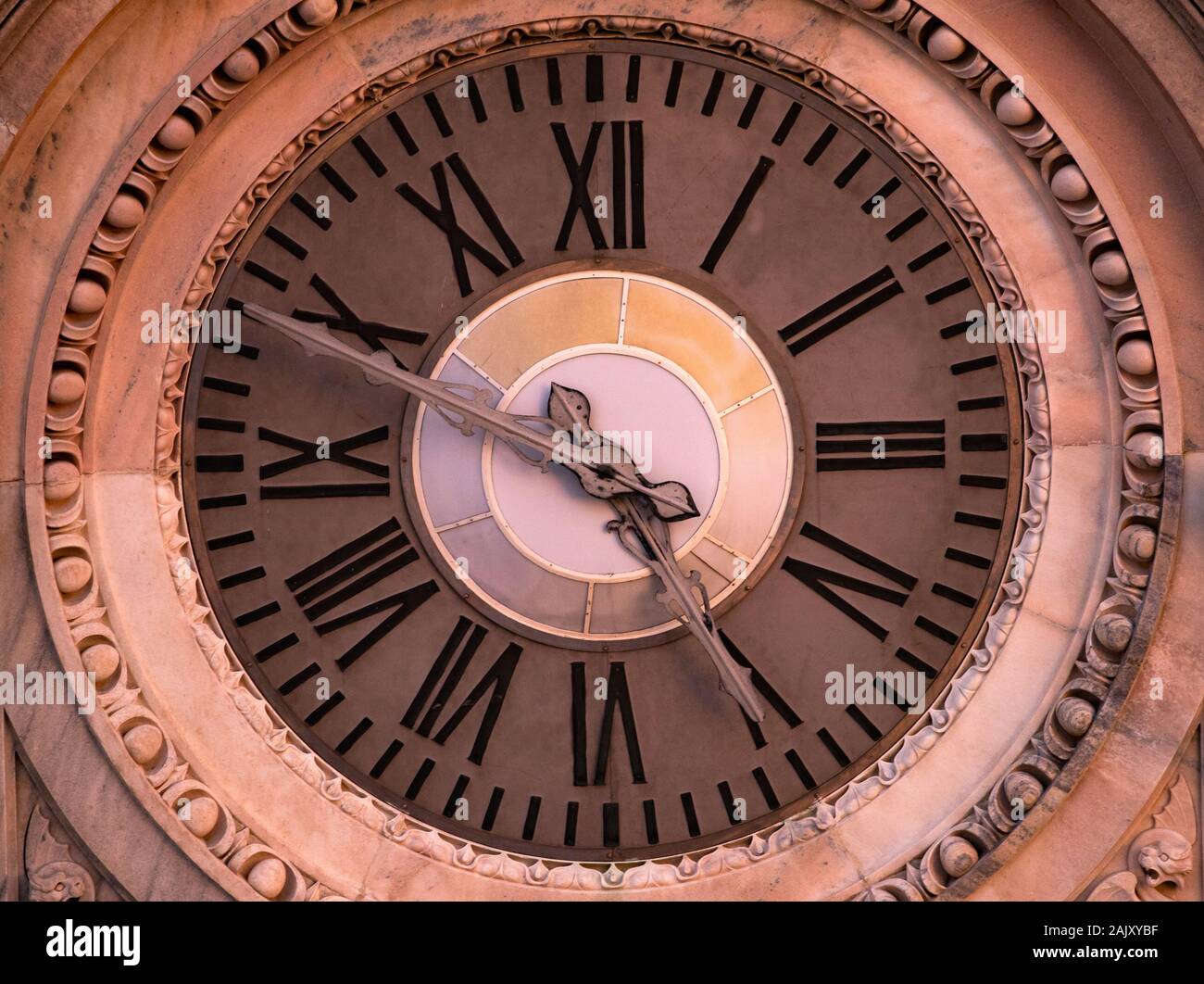 Large clock-face of old mechanical clock on a church tower in Milan ...