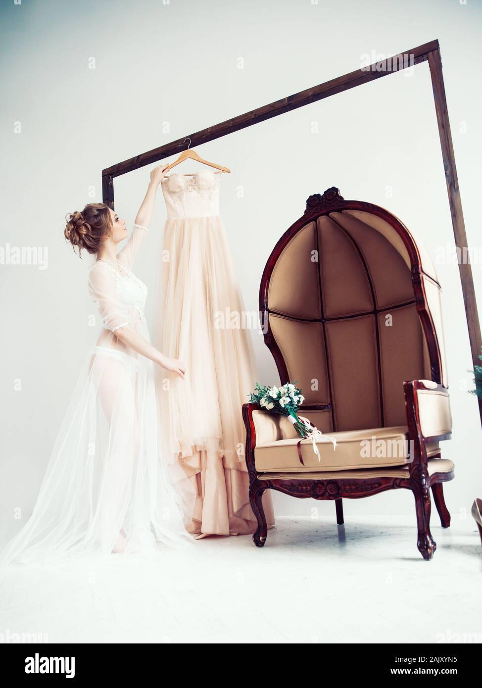 bride choosing a dress for the wedding ceremony Stock Photo - Alamy