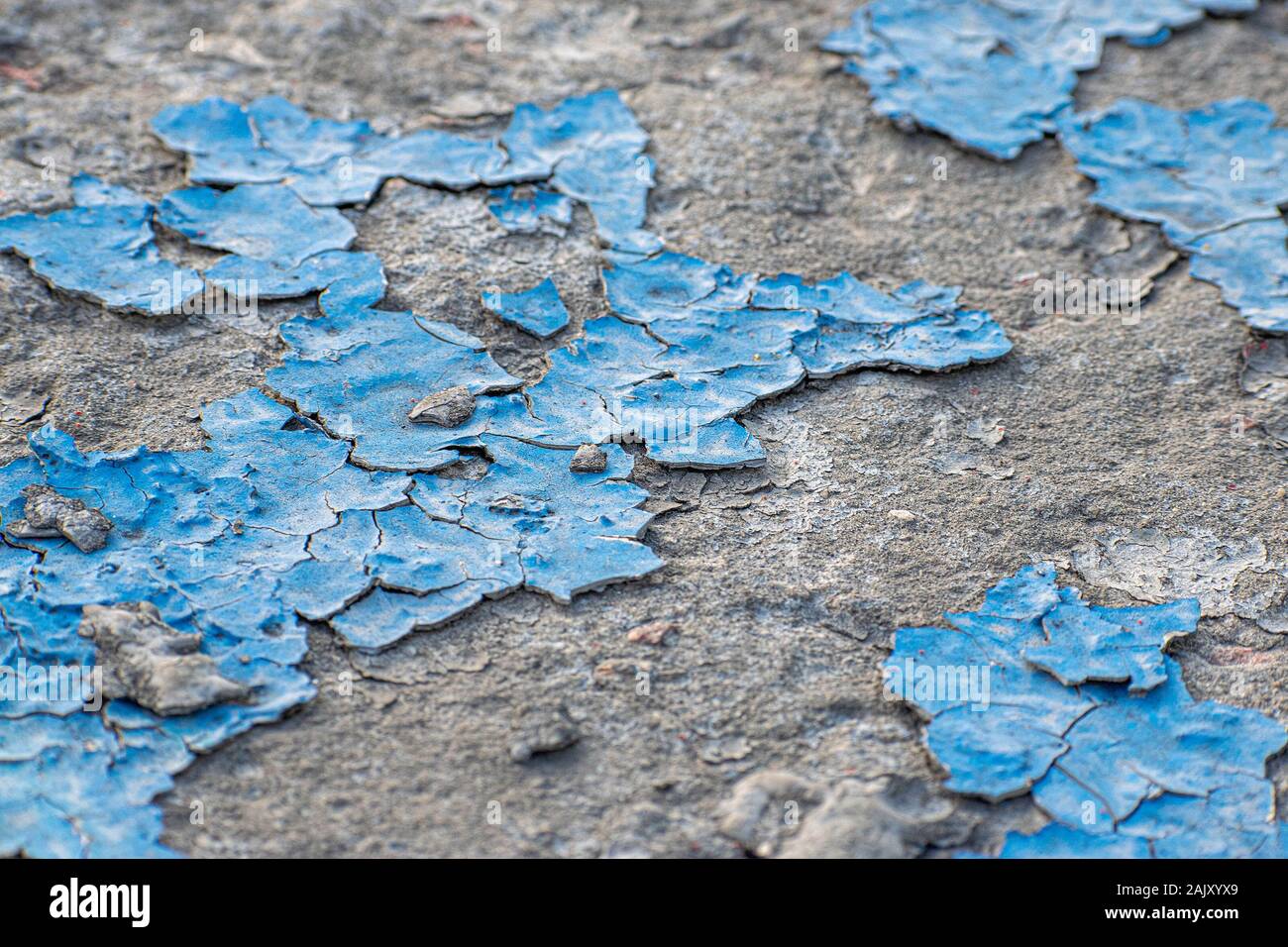 Cracked paint peeling off the concrete surface Stock Photo - Alamy