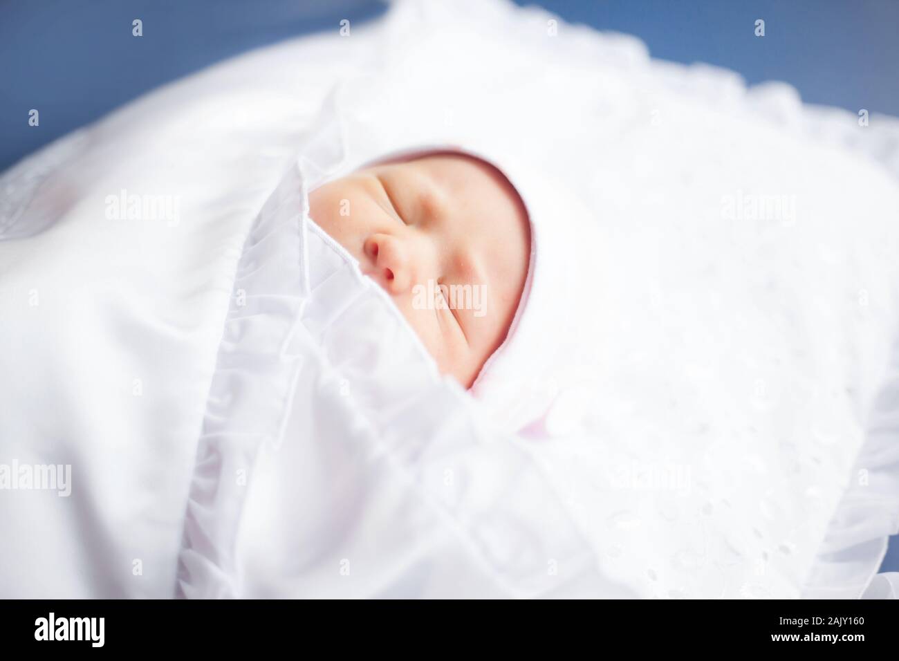 newborn baby wrapped in a white diaper Stock Photo - Alamy