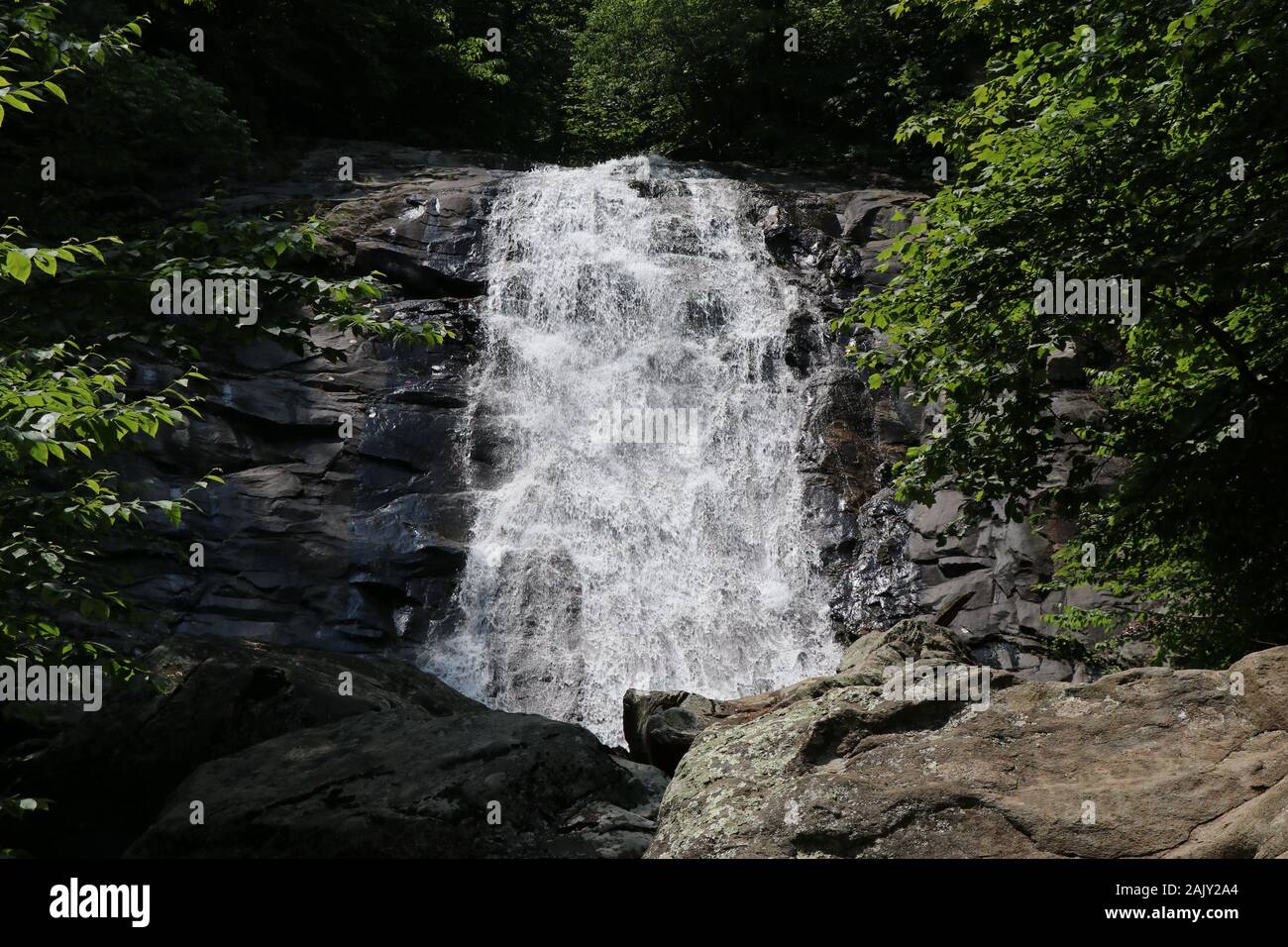 Waterfall Along a Hiking Path Stock Photo - Alamy