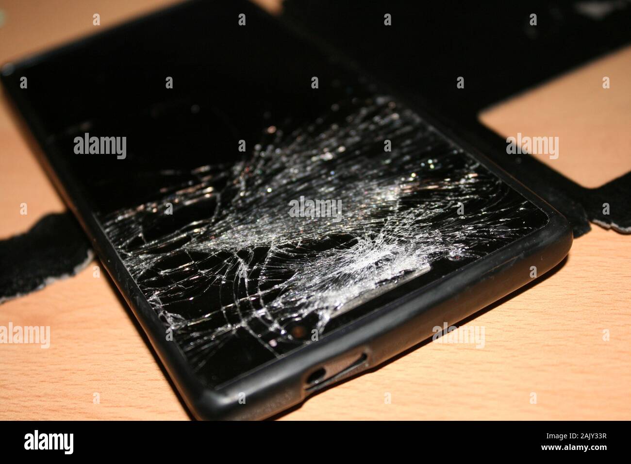 Broken phone screen close-up. Everyone's horror Stock Photo - Alamy
