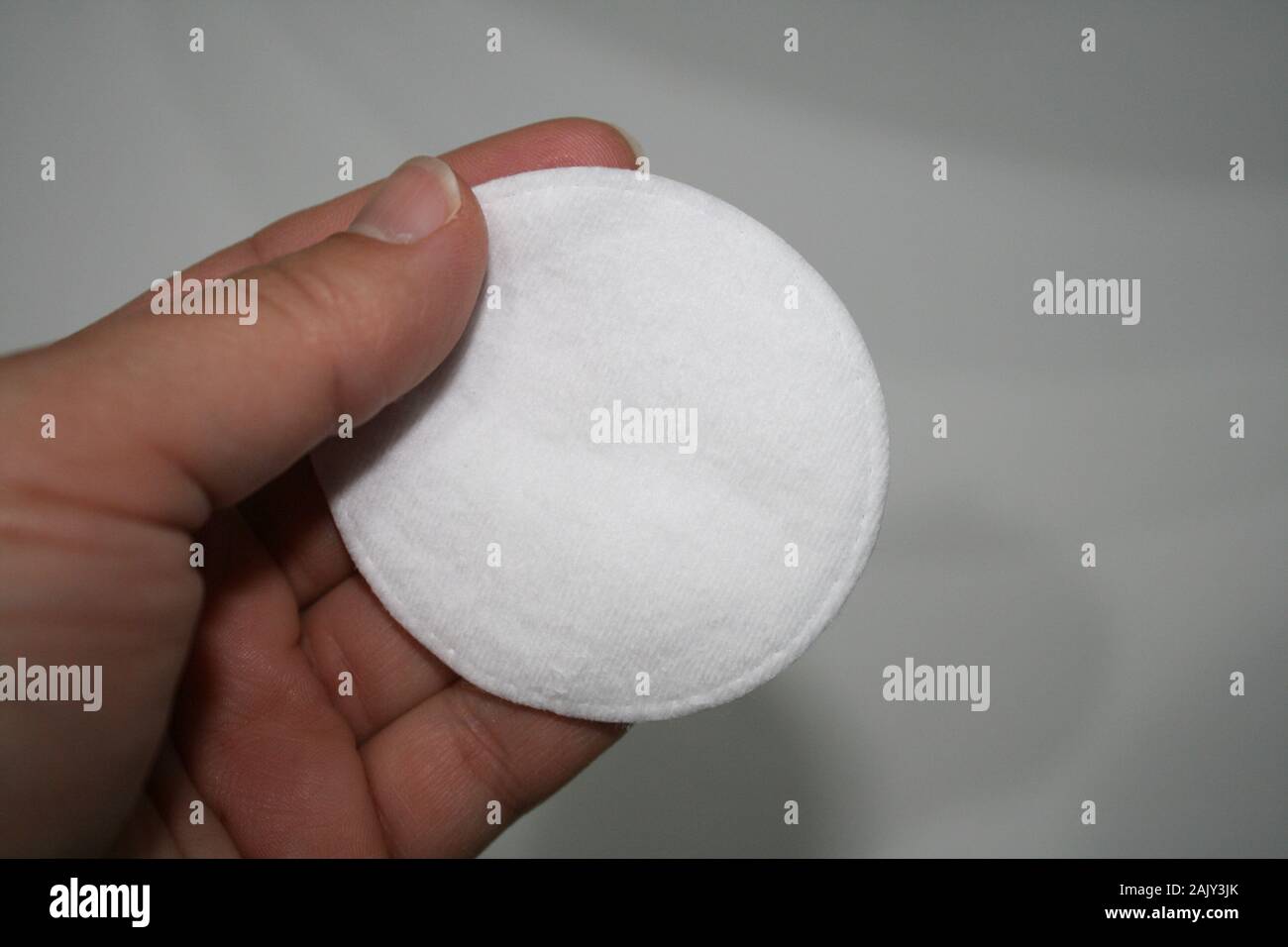 Cotton swab in a woman's hand Stock Photo - Alamy