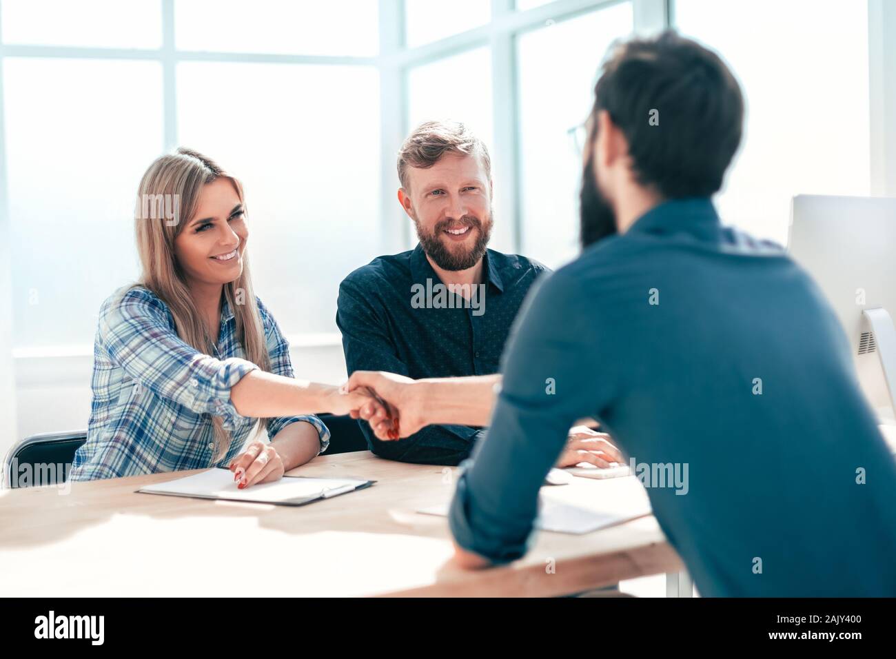 managers interview the applicant sitting at the office table Stock ...