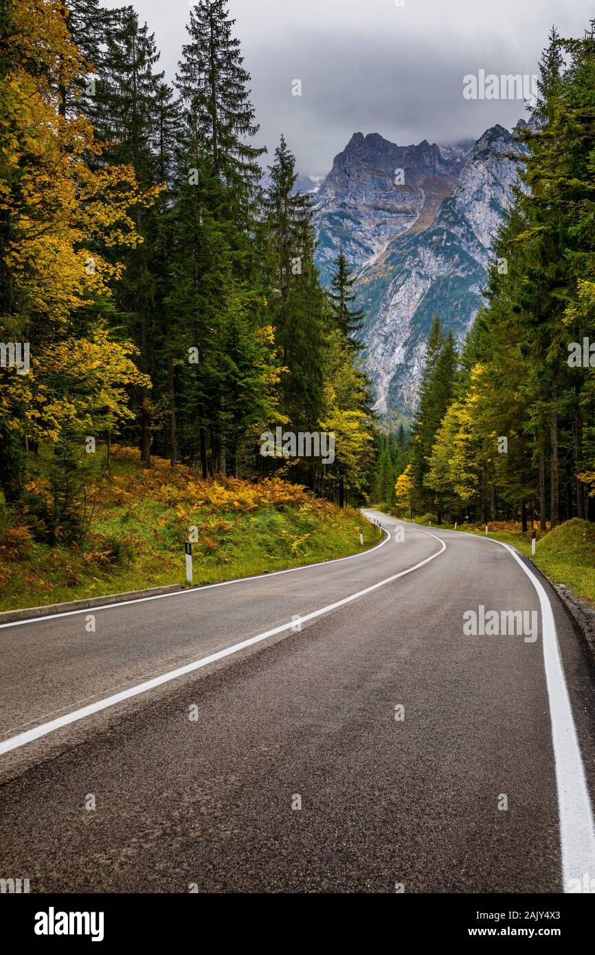 Mountain road. Landscape with rocks, sunny sky with clouds and ...