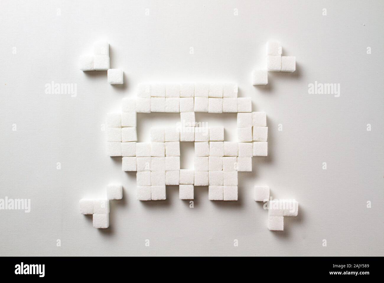 pixel art skull made out of sugar cubes on a white background ...