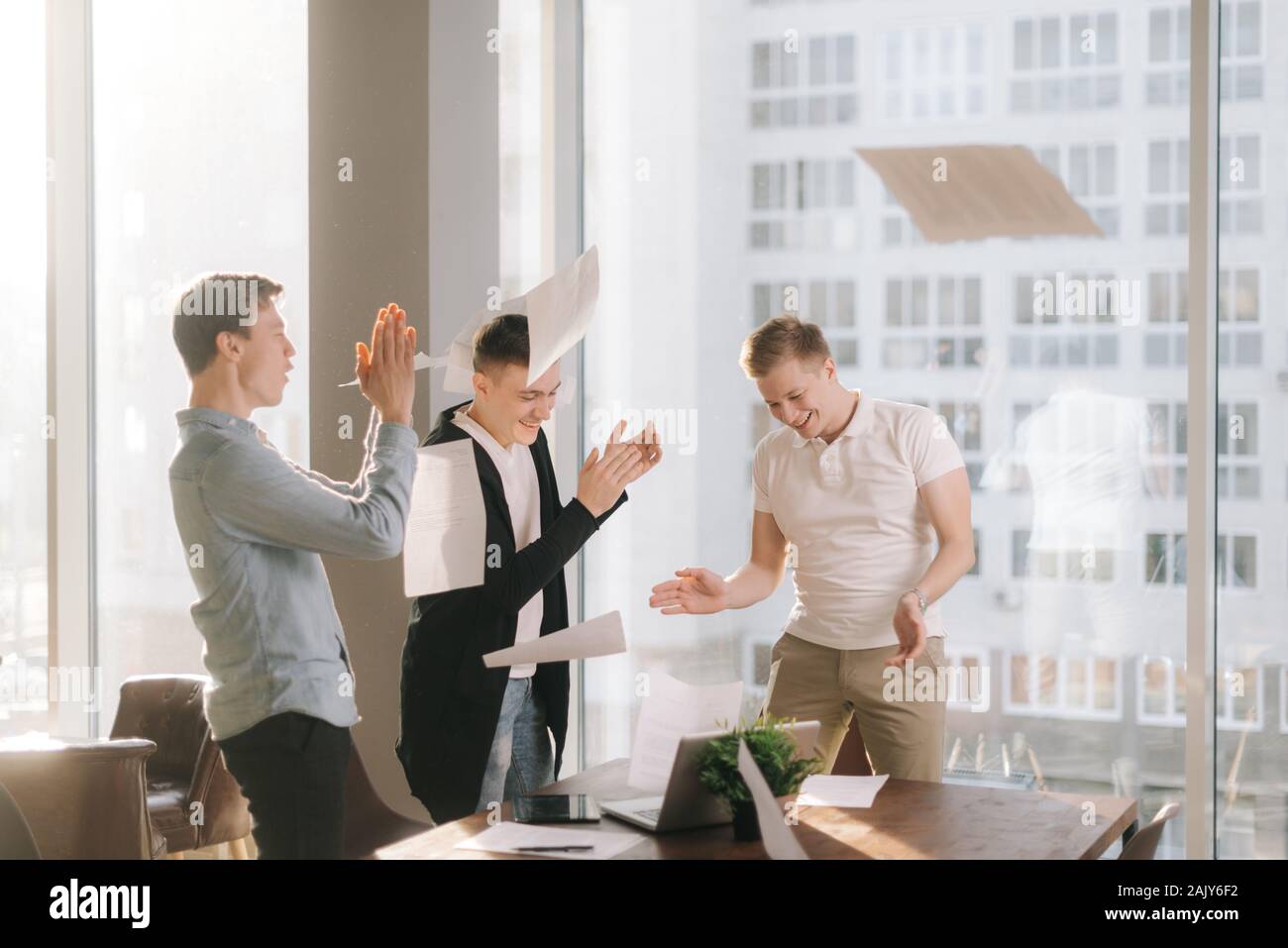 Successful business team are having fun throwing paper documents Stock ...