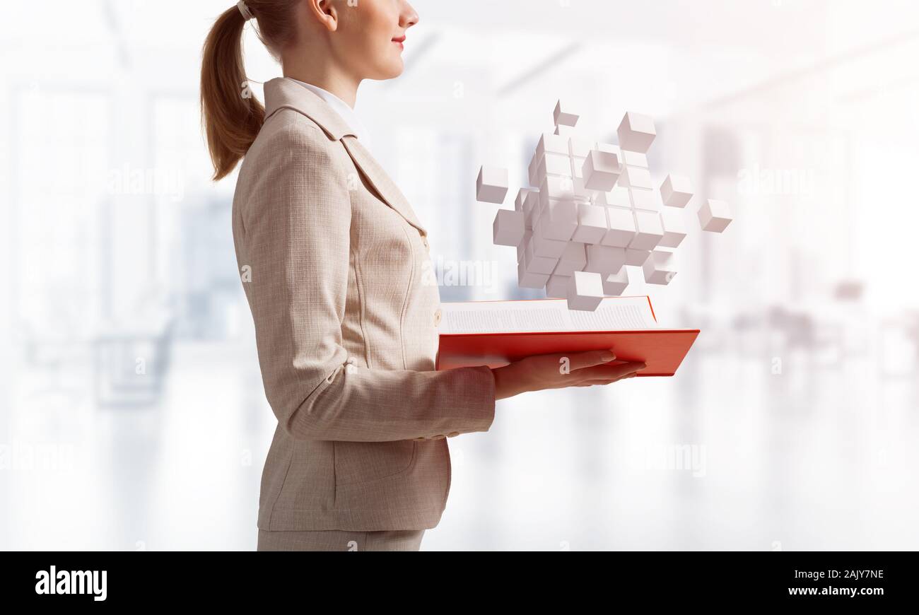 Young woman holding open notebook Stock Photo - Alamy