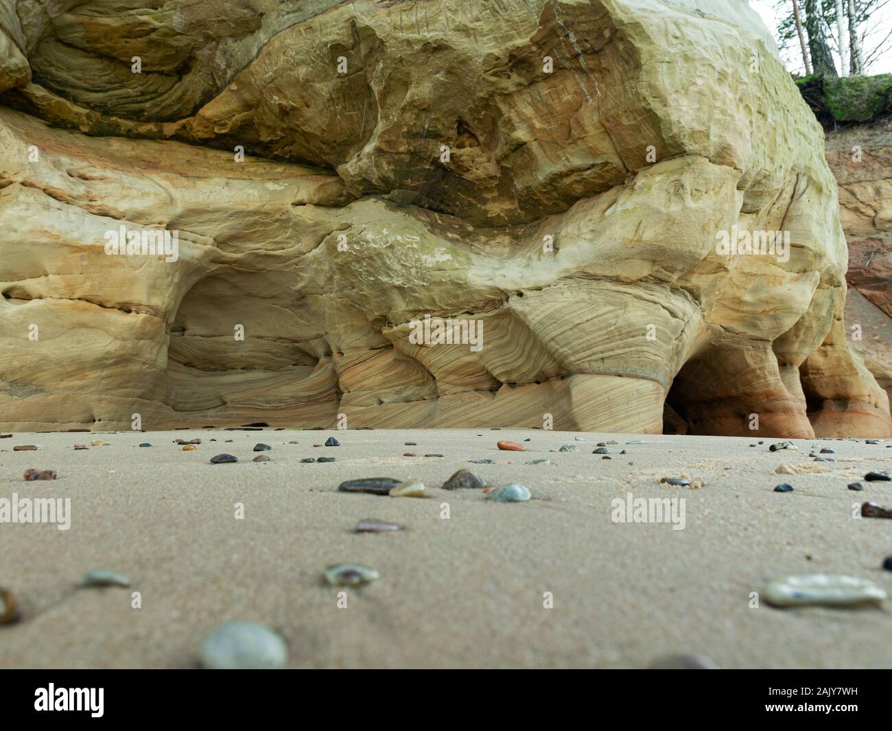 landscape with sandstone rock fragments on blurred background, Vidzeme ...