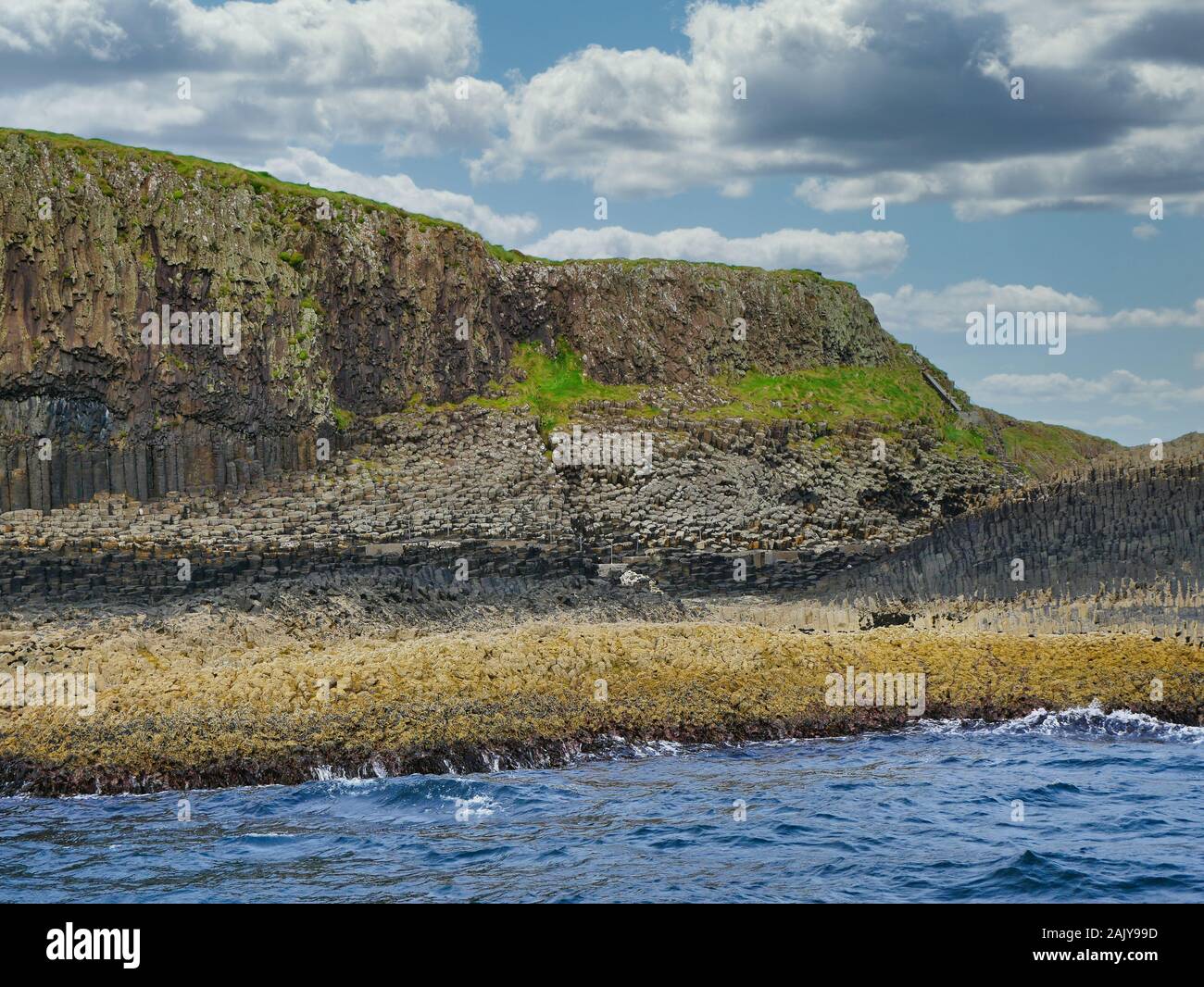 Columns of jointed volcanic basalt rock in which the vertical joints ...