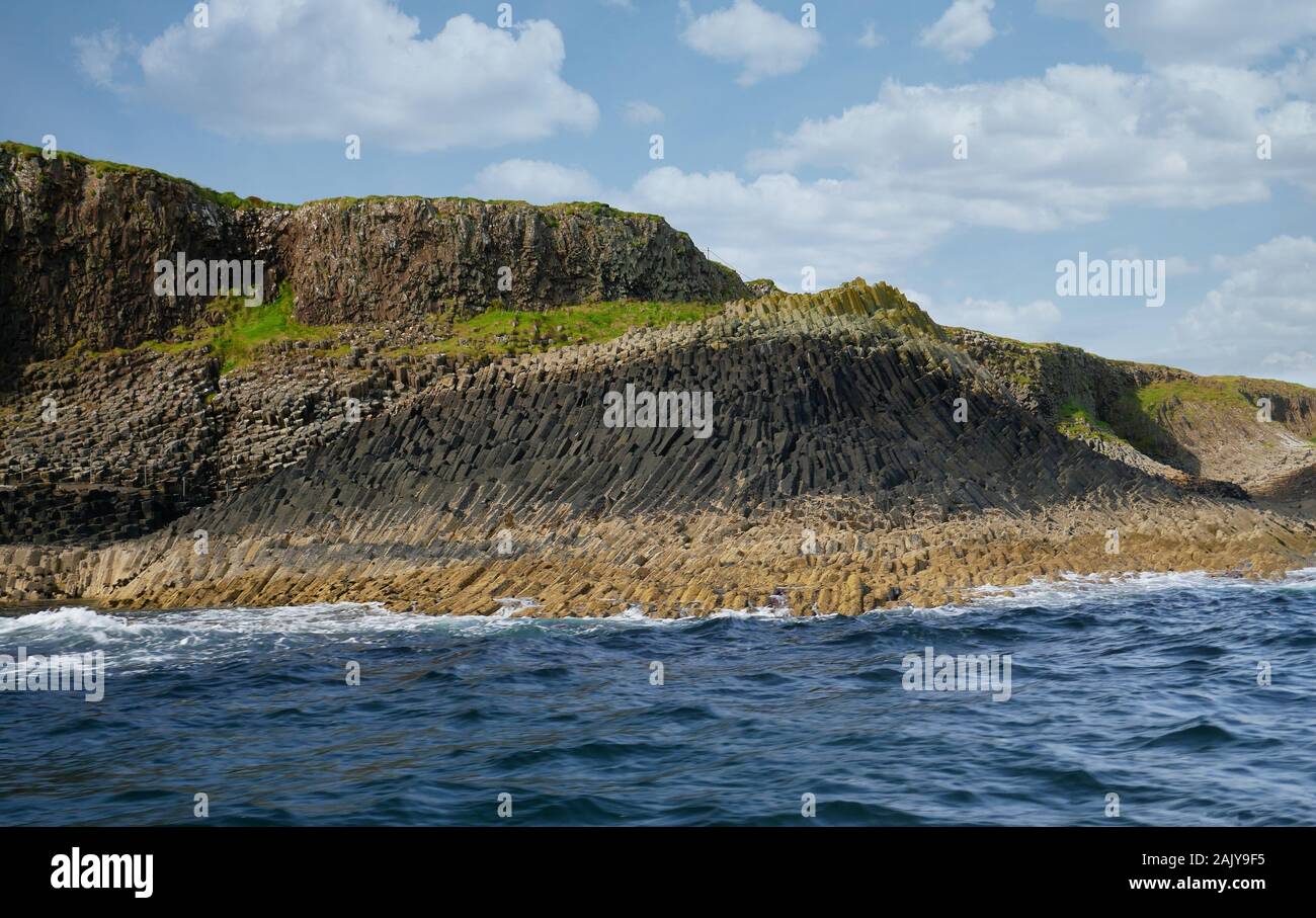Columns of jointed volcanic basalt rock in which the vertical joints ...
