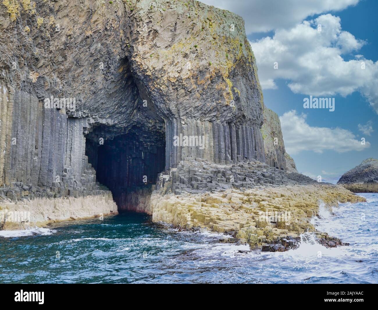 Fingal's Cave surrounded by columns of jointed volcanic basalt rocks in ...