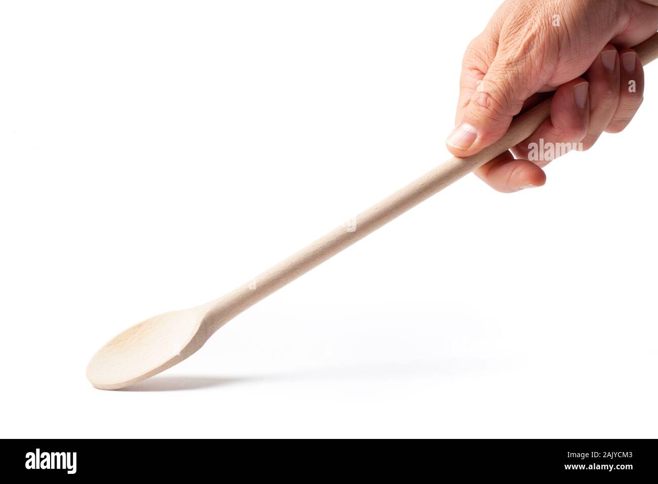 Human hand with a wooden cooking spoon with working path isolated on ...