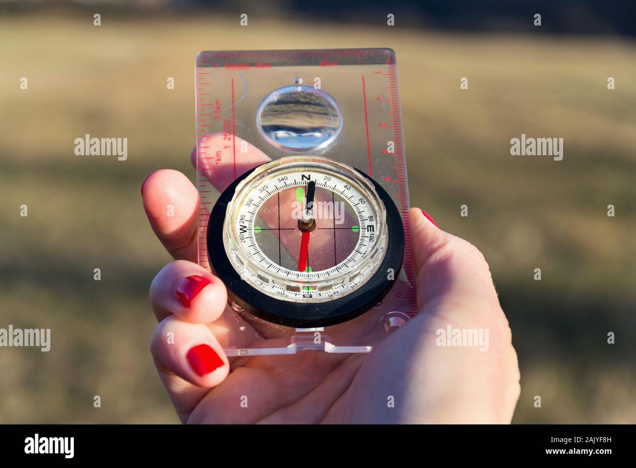 Hand compass red hi-res stock photography and images - Alamy