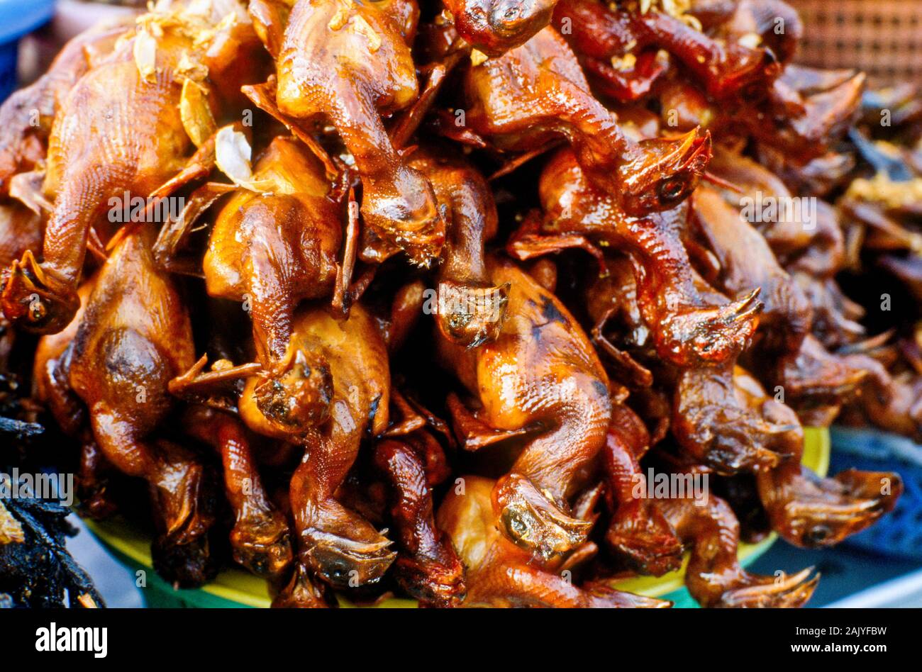 Fried little birds are delicassies for people in Pnom Penh Stock Photo ...