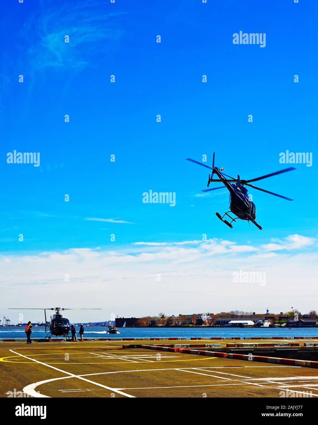 Black Helicopter taking off from helipad in Lower Manhattan USA reflex ...