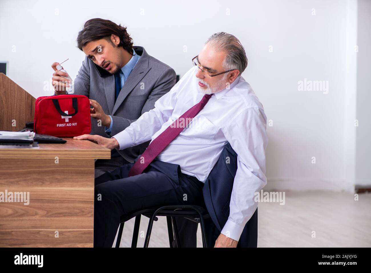 The male employee suffering from heart attack in the office Stock Photo ...