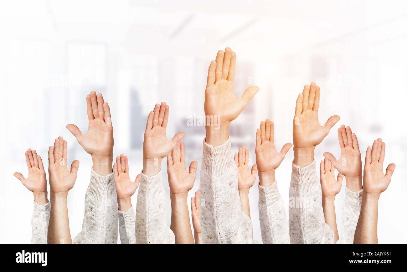 Row of man hands showing voting gesture Stock Photo - Alamy