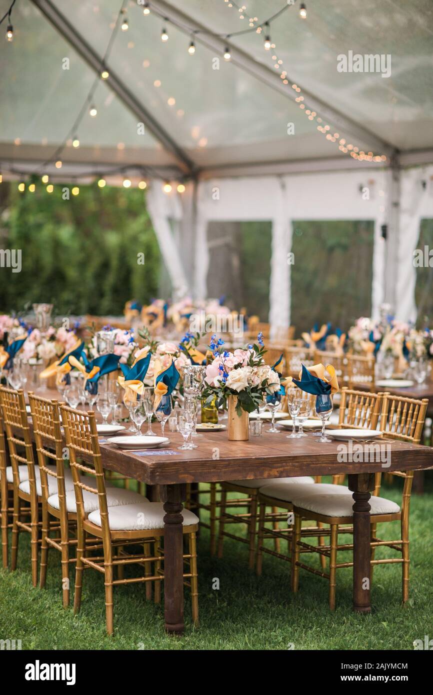 Beautiful wedding reception inside a tent Stock Photo - Alamy