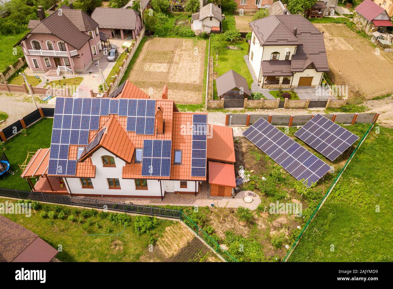 Aerial top view of new modern residential house cottage with blue shiny ...