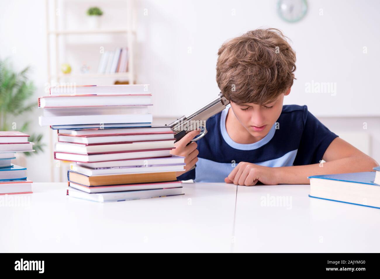 The young student stressed due to excessive studies Stock Photo - Alamy