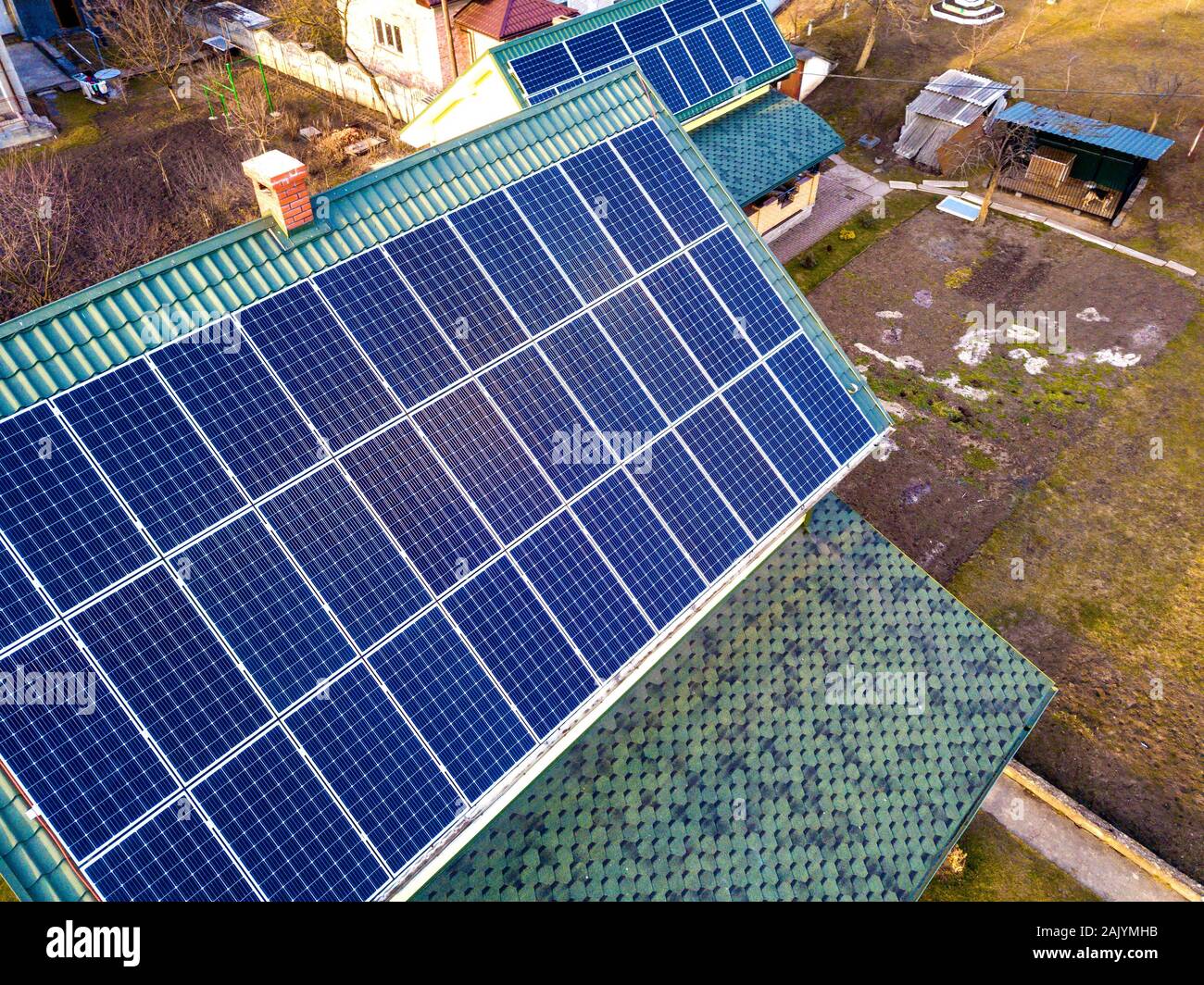 Aerial top view of new modern residential house cottage with blue shiny ...