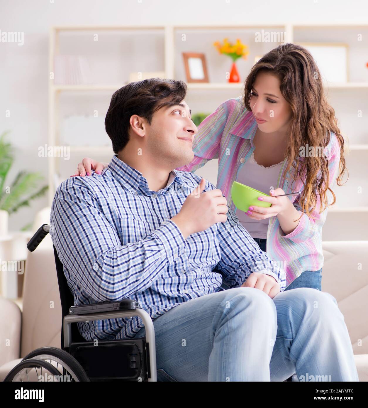 The young family taking care of each other Stock Photo - Alamy