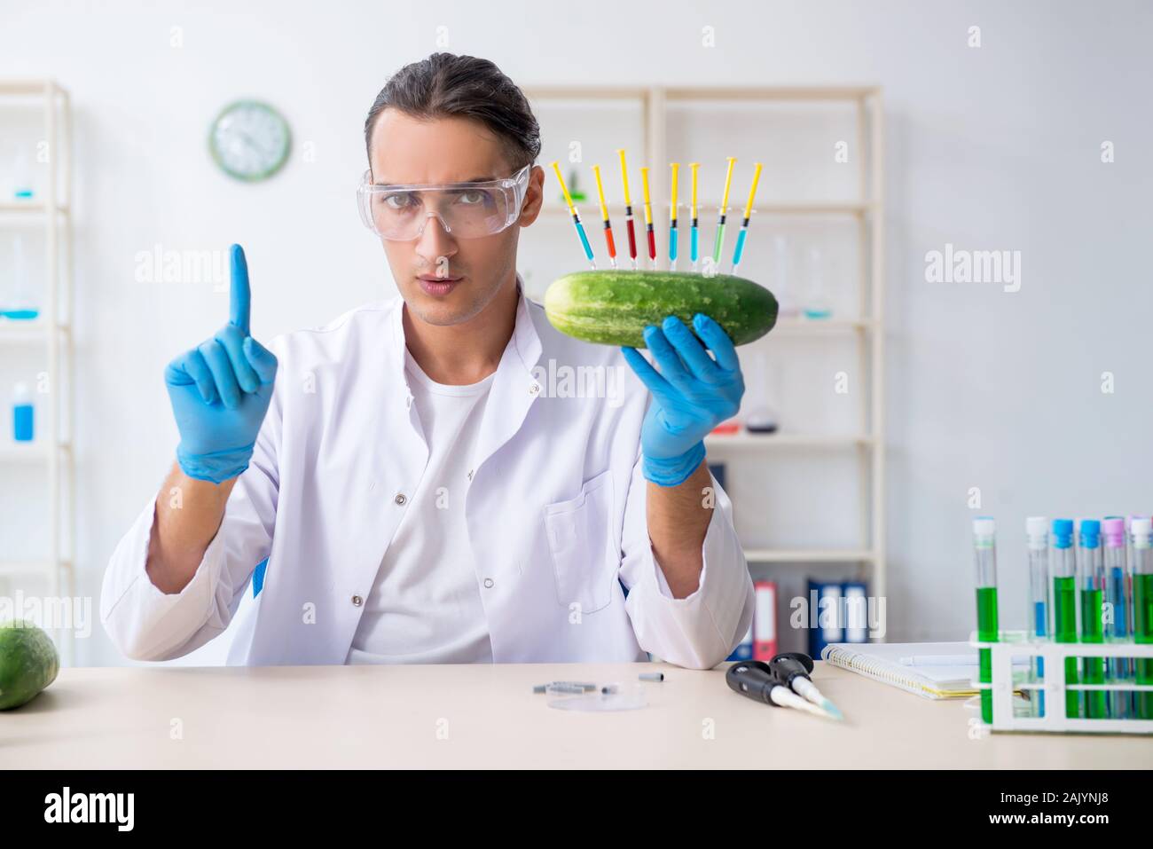 The male nutrition expert testing vegetables in lab Stock Photo - Alamy