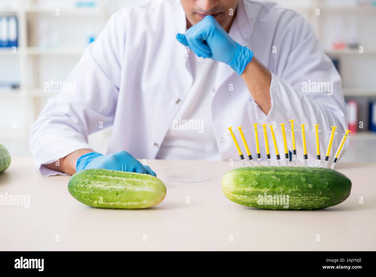The male nutrition expert testing vegetables in lab Stock Photo - Alamy
