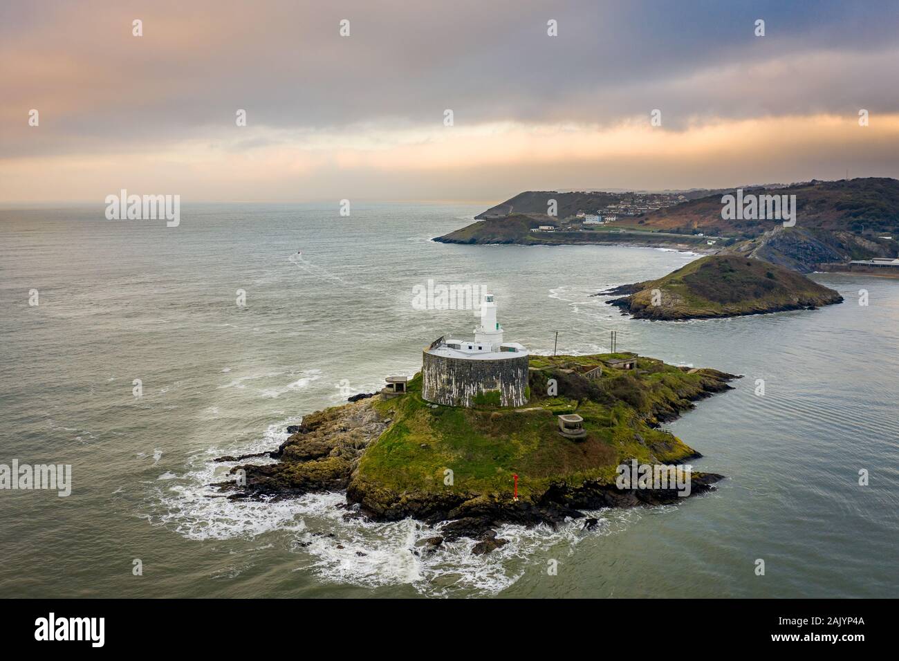 Aerial view of a Offshore island with lighthouse on Mumbles Head in ...