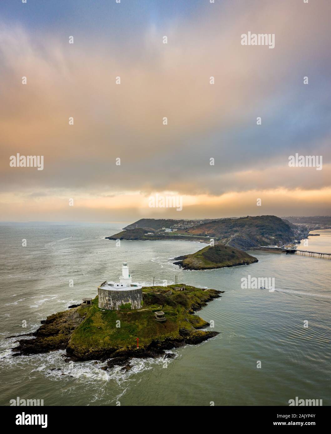 Aerial view of a Offshore island with lighthouse on Mumbles Head in ...