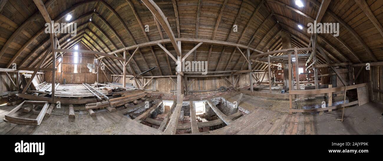 Old and dusty creepy wooden attic with roof framework structure of the ...