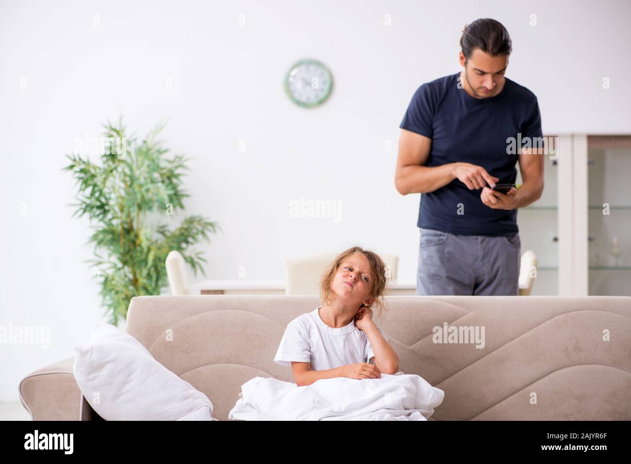 The father taking care of his ill daughter Stock Photo - Alamy